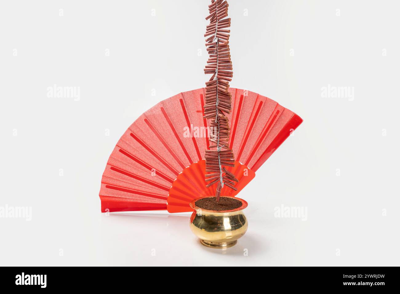 Incense pot and folding fan with a string of Chinese firecrackers on ...