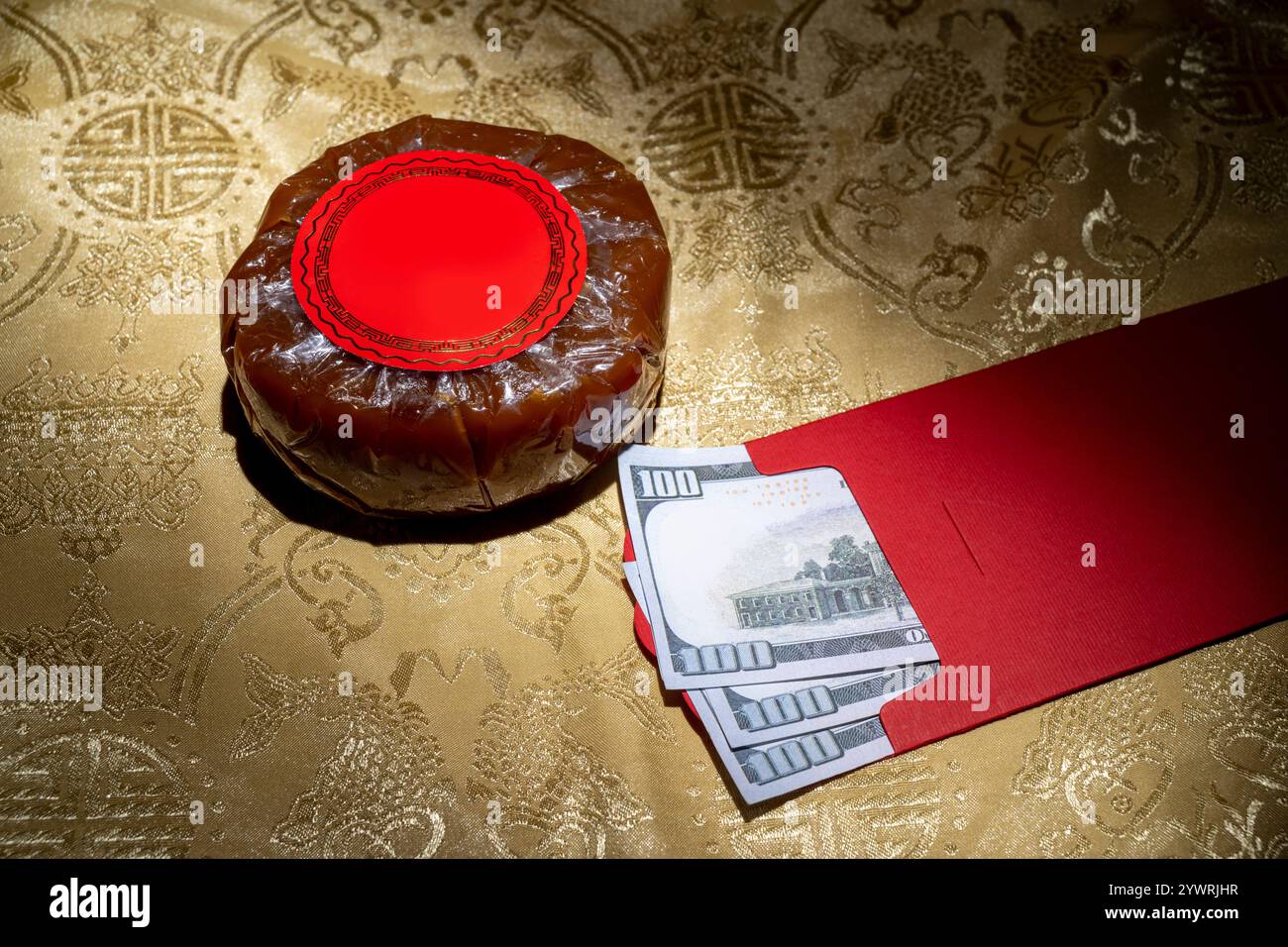 Chinese New Year rice cake or Nian Gao with red envelopes or angpao and ...