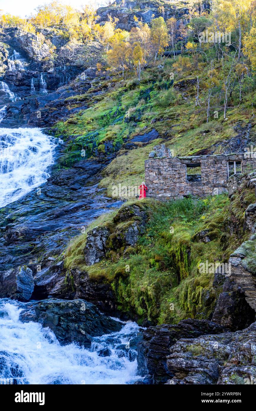 Huldra the Seducer in flowing red dress dances and sings beside ...
