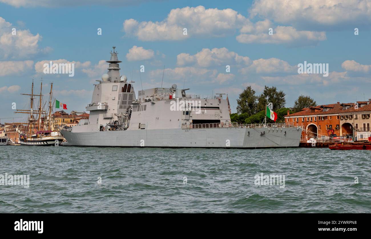 Old Italian navy ship outside in Venice lagoon water Stock Photo - Alamy