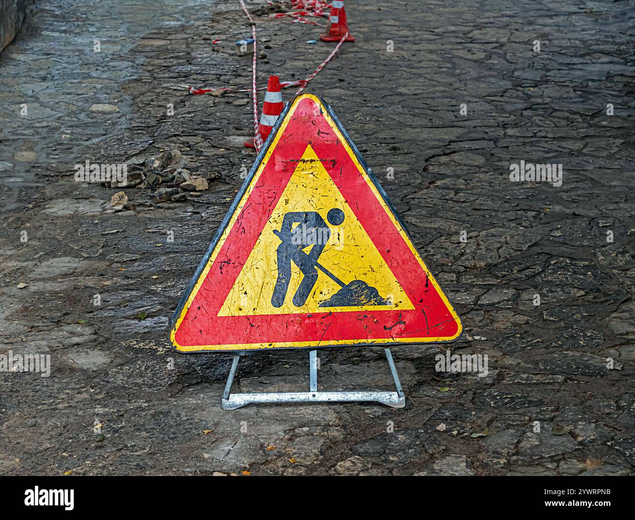 Triangle sign with road construction work logo outside in a street ...