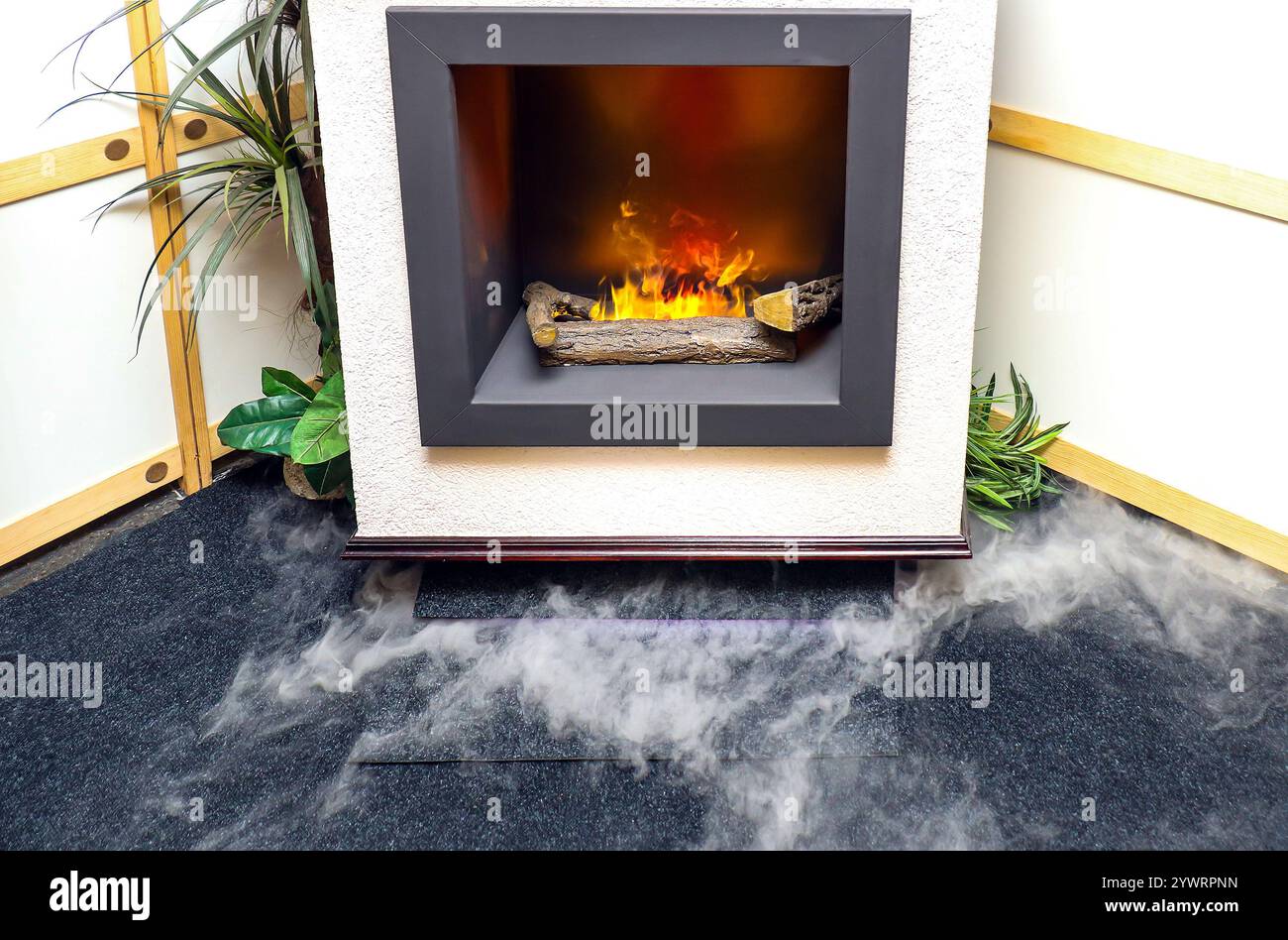 Artificial fireplace effect with ceramic logs inside home interior ...