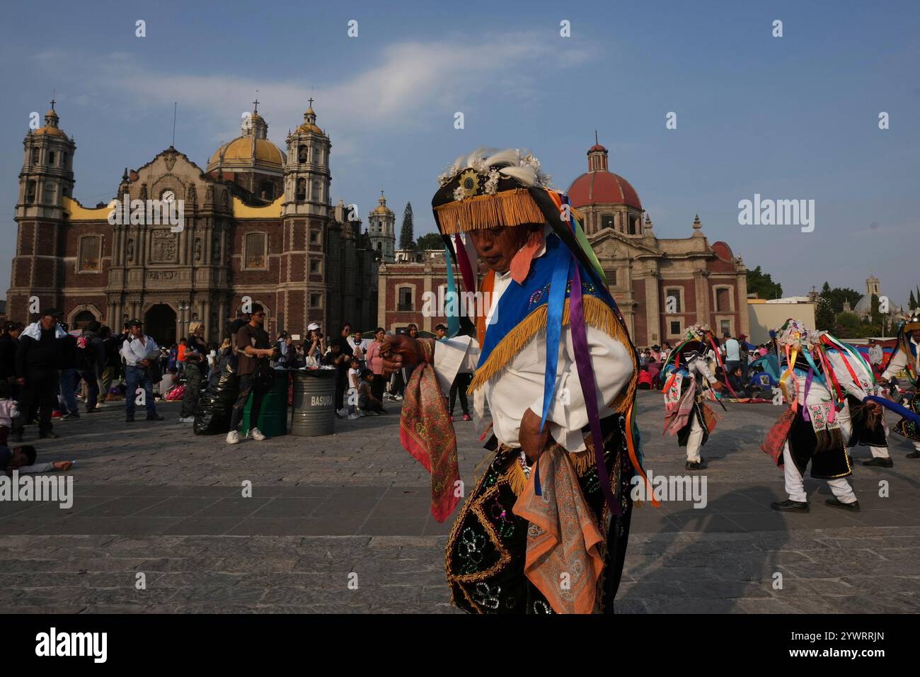 Pilgrims dance outside of the Basilica of Our Lady of Guadalupe a day ...