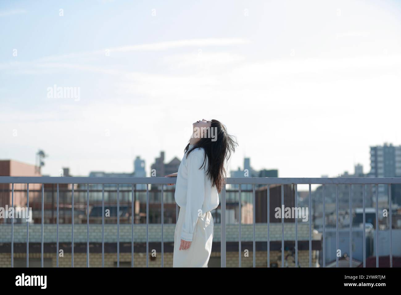 Woman looking up at sky hi-res stock photography and images - Alamy