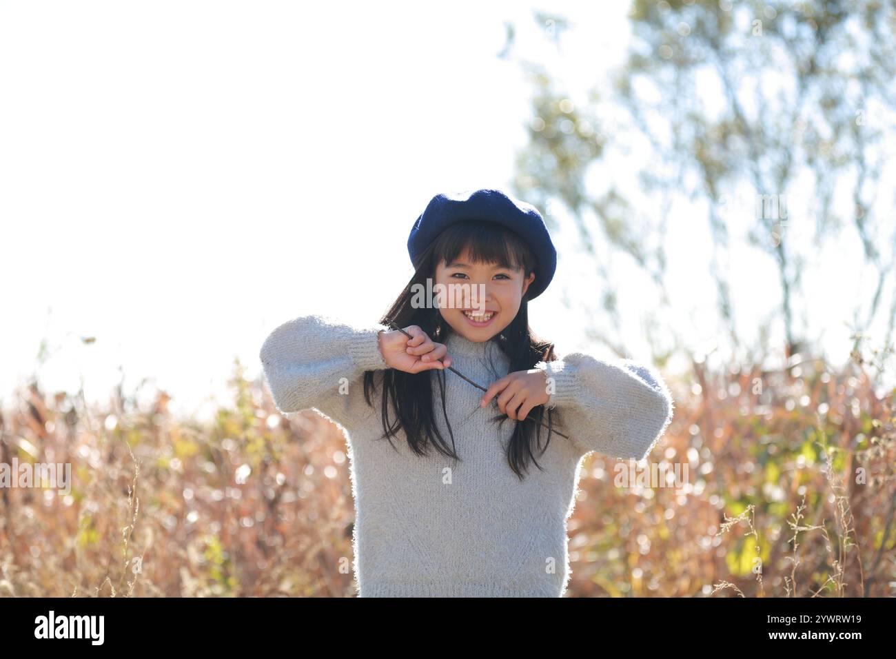 Girl in blue beret smiling Stock Photo - Alamy