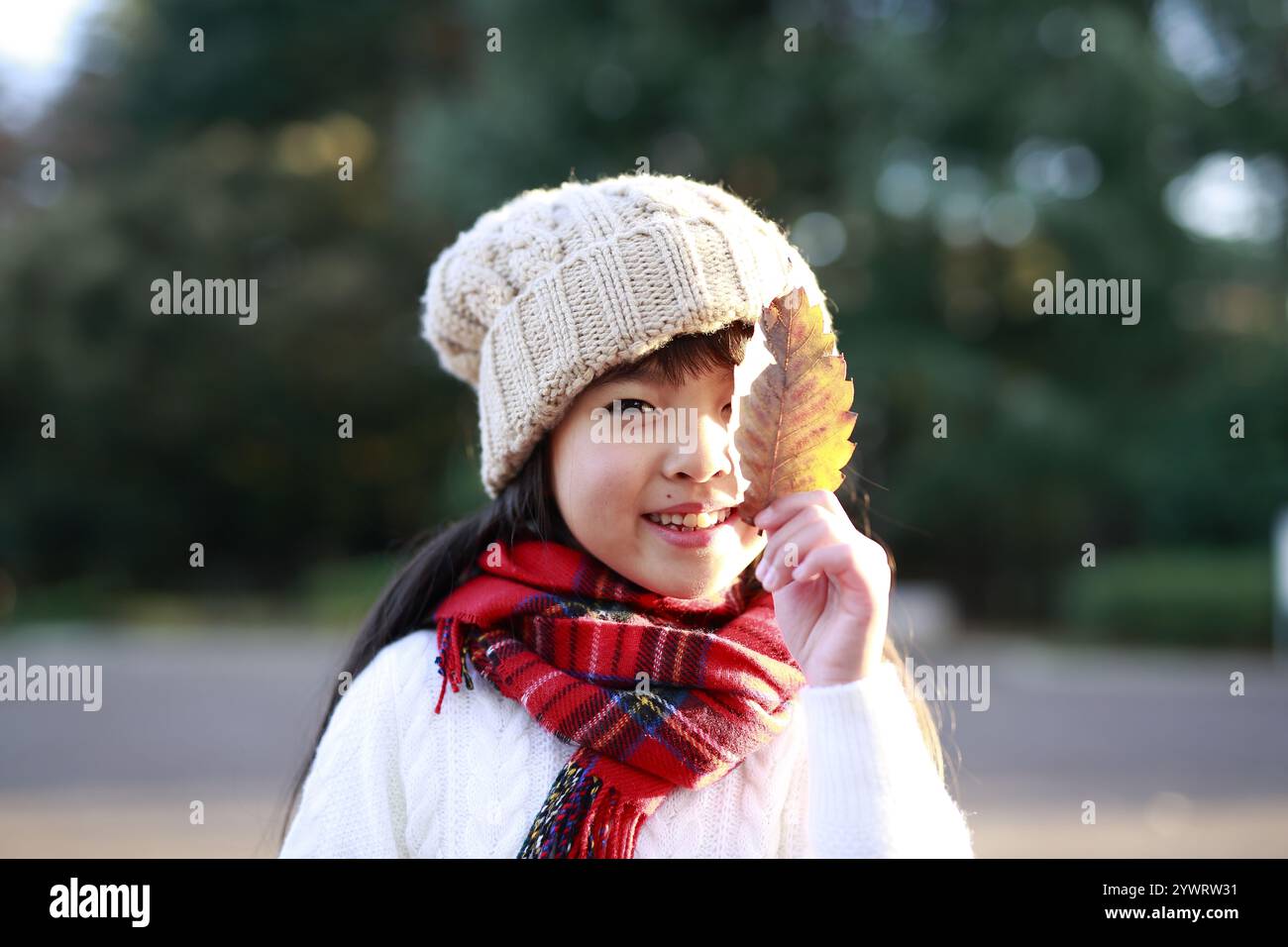 Girl with one fallen leaf in her hand Stock Photo - Alamy