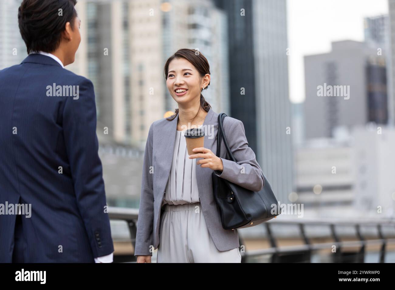 Two men stand conversing hi-res stock photography and images - Alamy