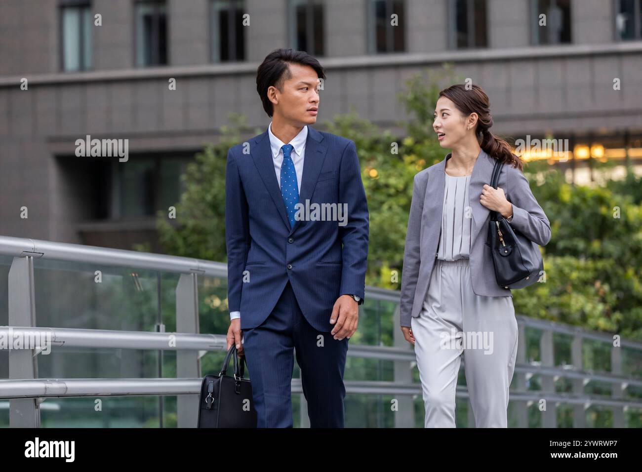 Two japanese businessmen walking hi-res stock photography and images ...