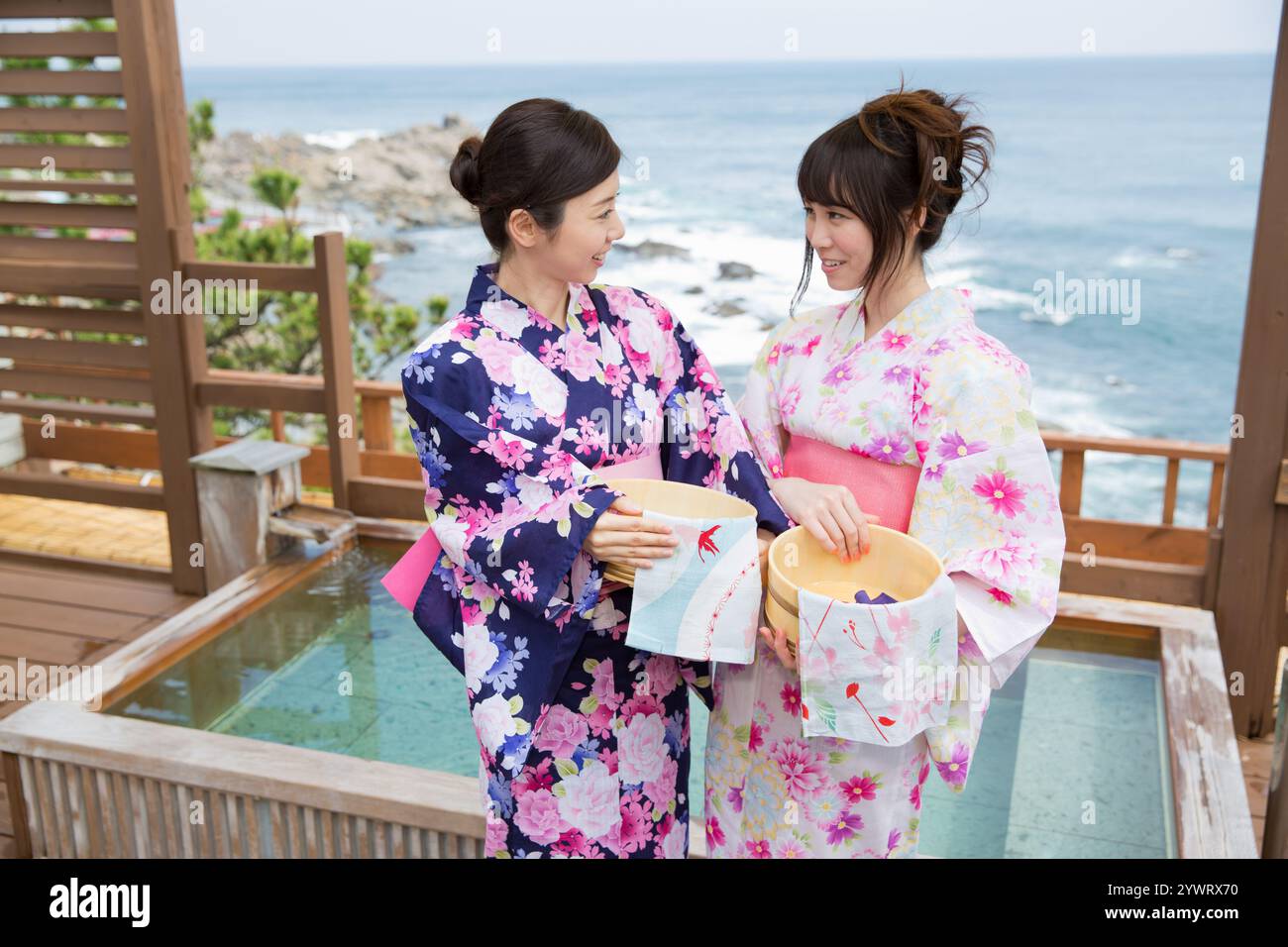 Two young women in yukata standing in front of the open-air bath Stock ...