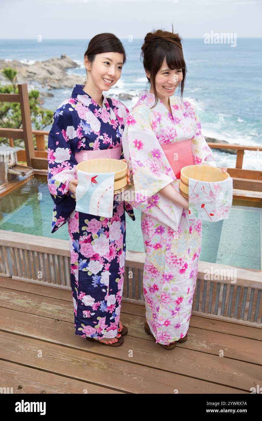 Two young women in yukata standing in front of the open-air bath Stock ...