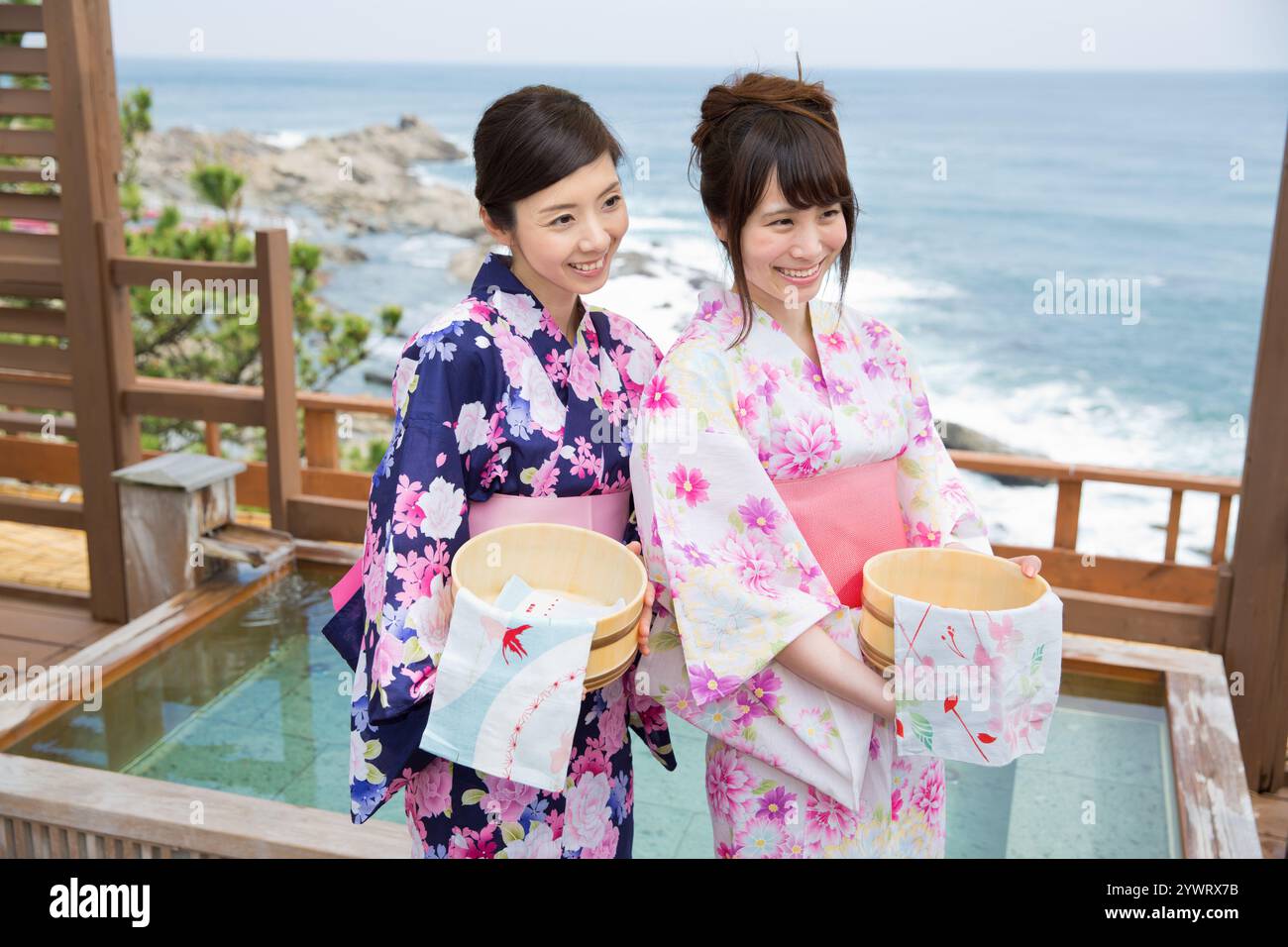 Two young women in yukata standing in front of the open-air bath Stock ...