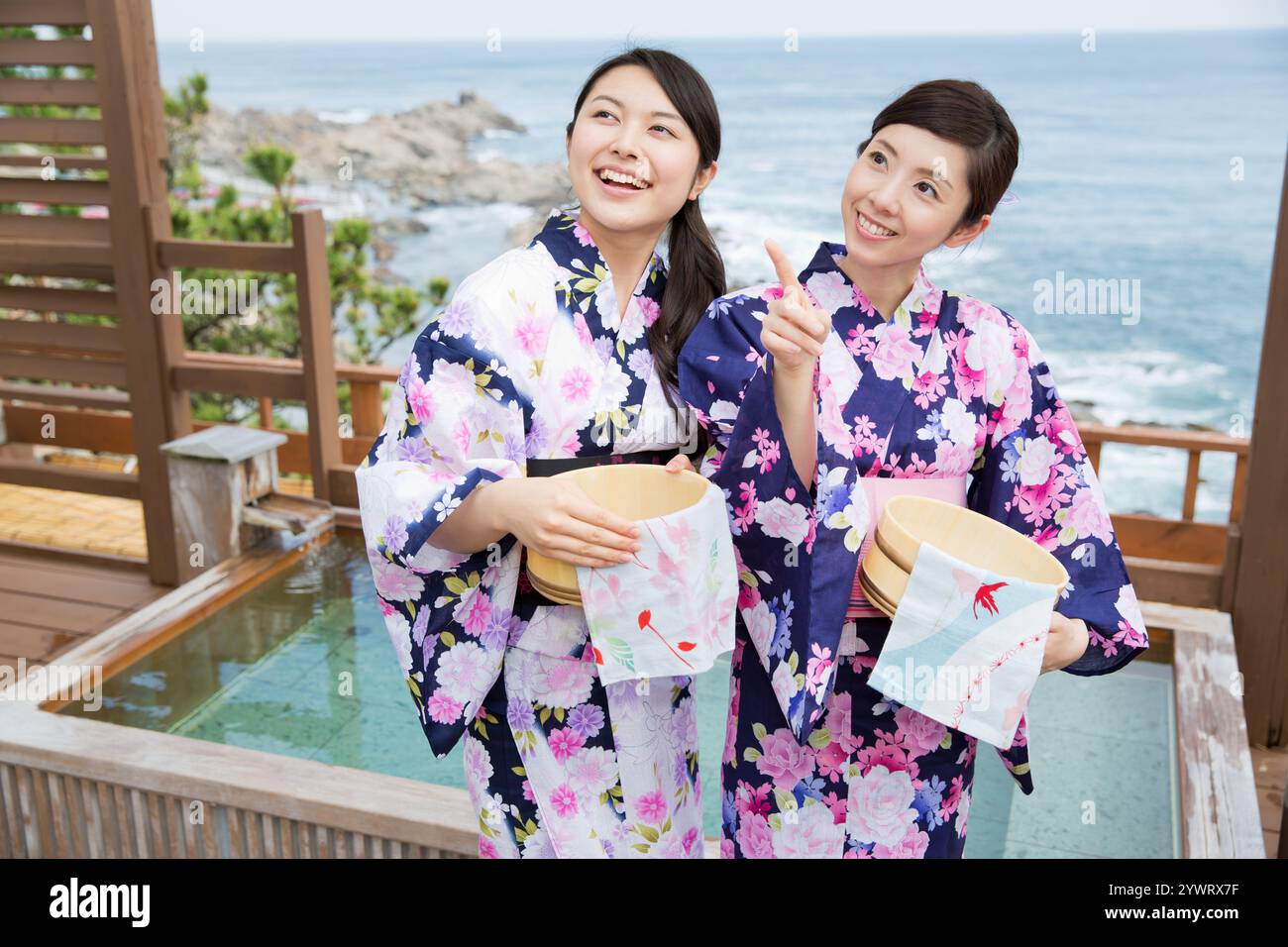 Two young women in yukata standing in front of the open-air bath Stock ...