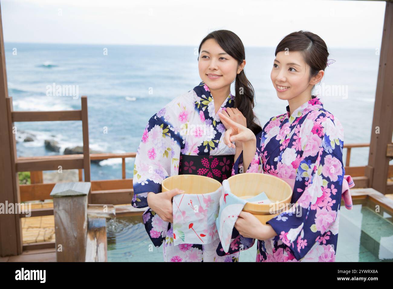 Two young women in yukata standing in front of the open-air bath Stock ...