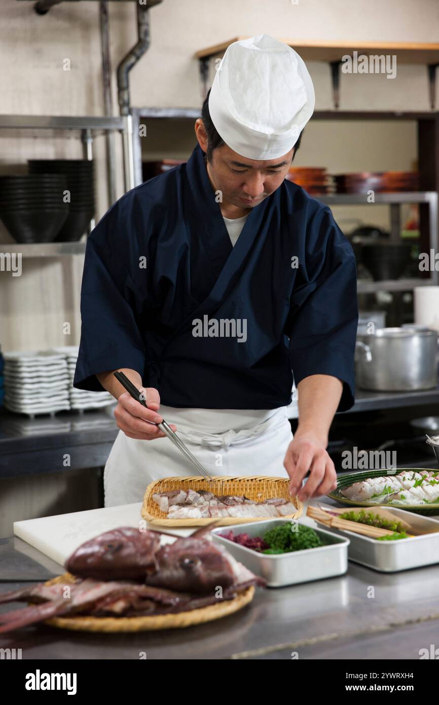 The cook who arranges the sea bream matsubi zukuri Stock Photo - Alamy