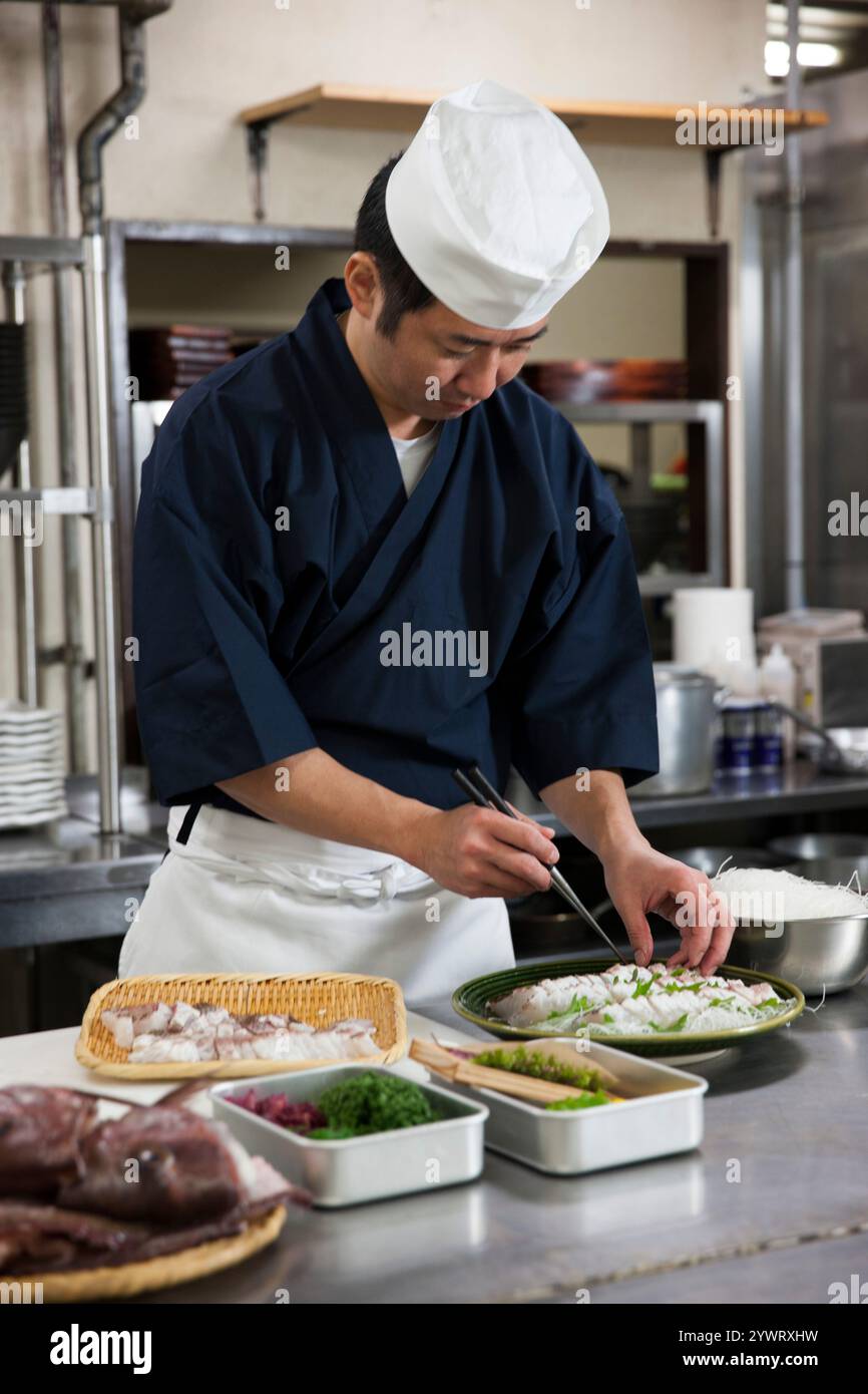 The cook who arranges the sea bream matsubi zukuri Stock Photo - Alamy