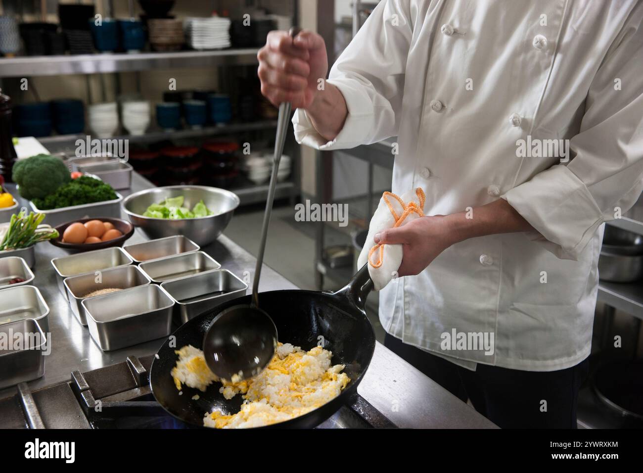 Cook making fried rice Stock Photo - Alamy