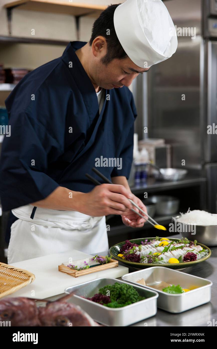 The cook who arranges the sea bream matsubi zukuri Stock Photo - Alamy