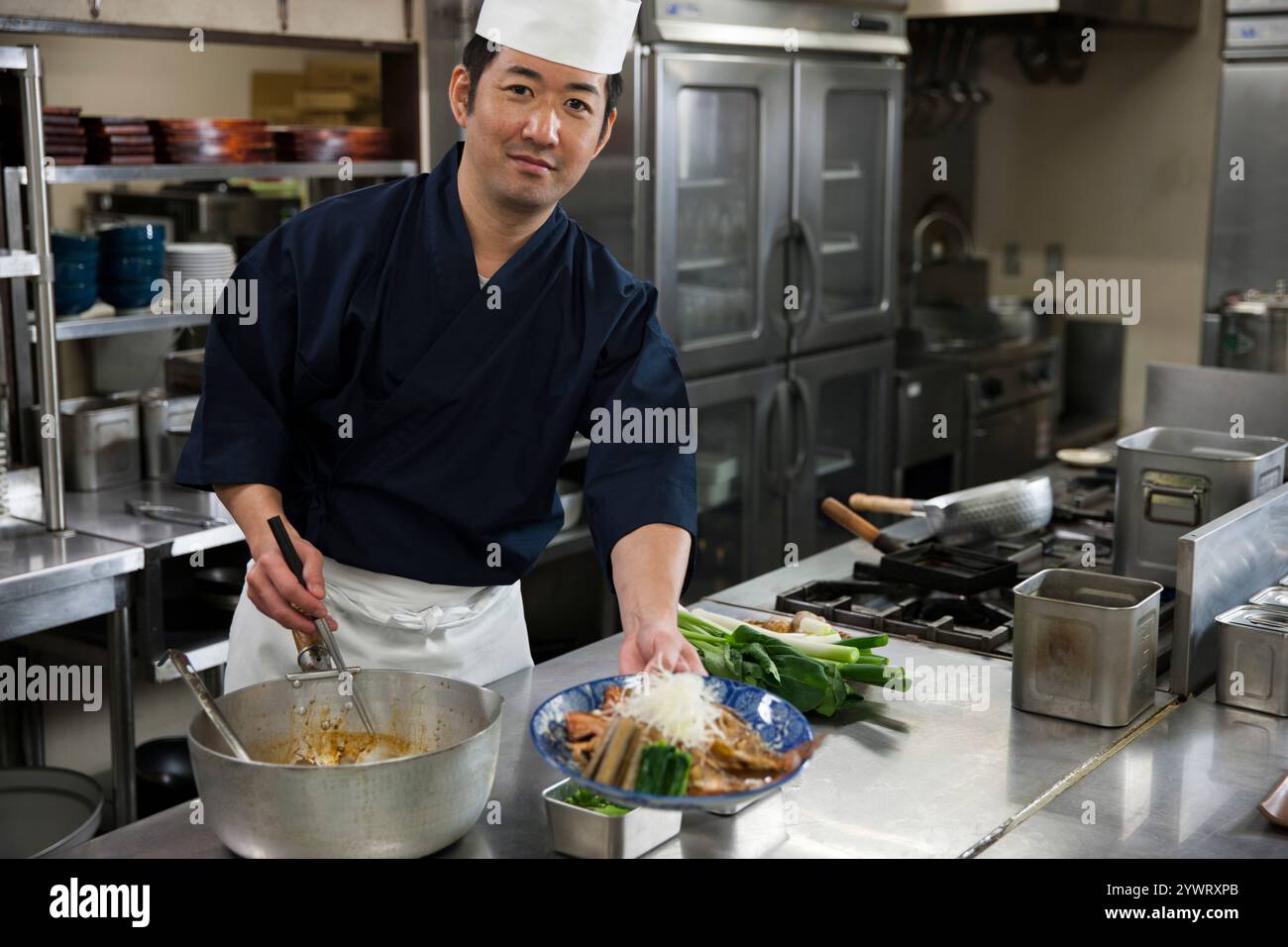 Man offering fish hi-res stock photography and images - Alamy