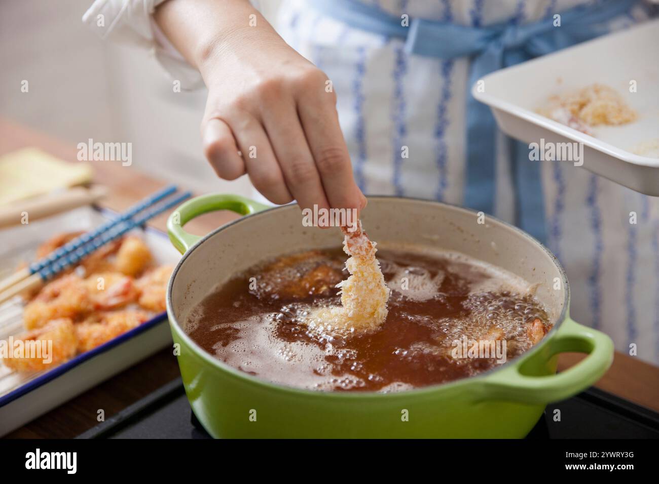 Woman cooking shrimp in hi-res stock photography and images - Alamy
