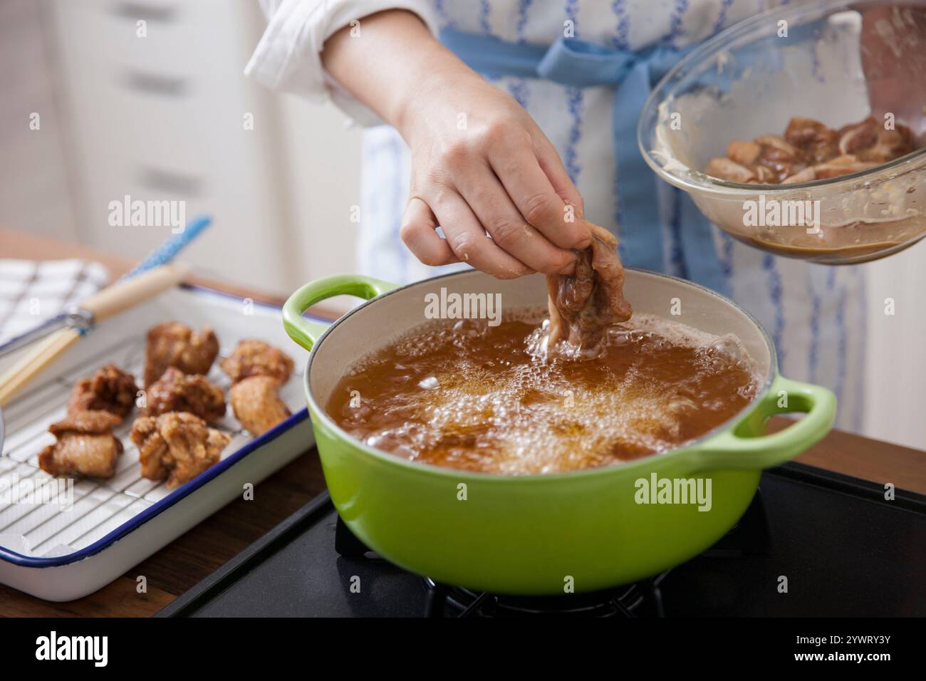 Woman frying fried food hi-res stock photography and images - Alamy