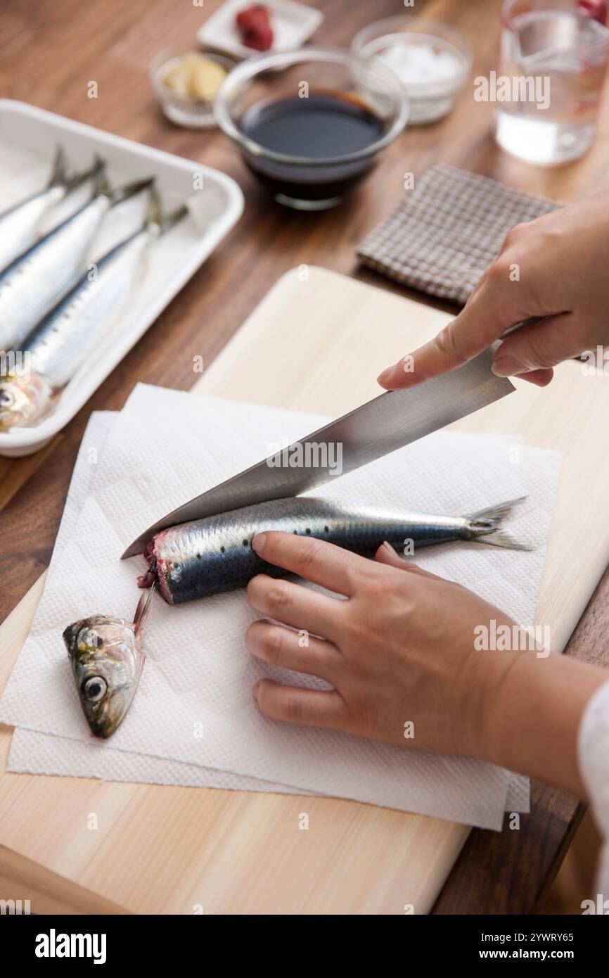 Preparing sardines hi-res stock photography and images - Alamy