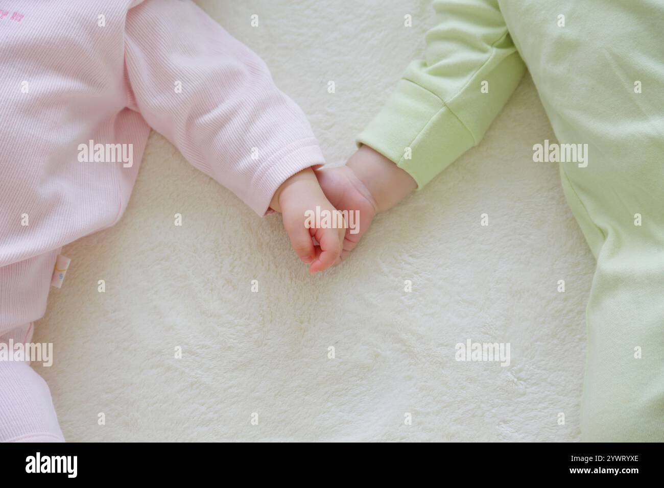 Boy and girl hold hands hi-res stock photography and images - Alamy