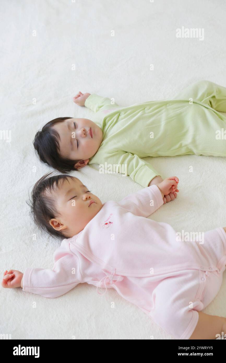 Two babies boy girl hi-res stock photography and images - Alamy