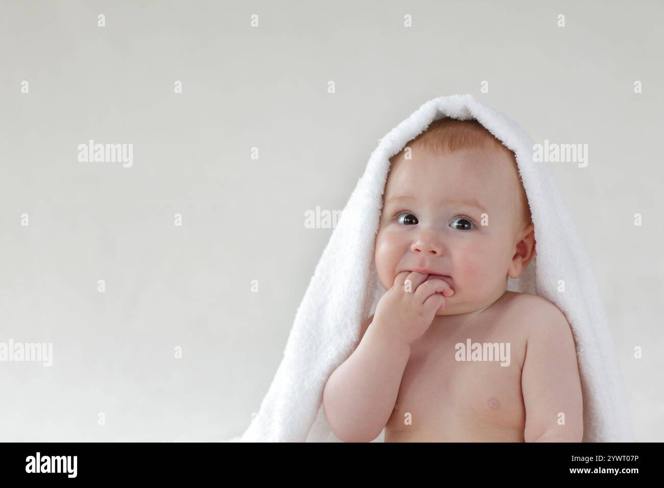 Baby with towel over head Stock Photo - Alamy