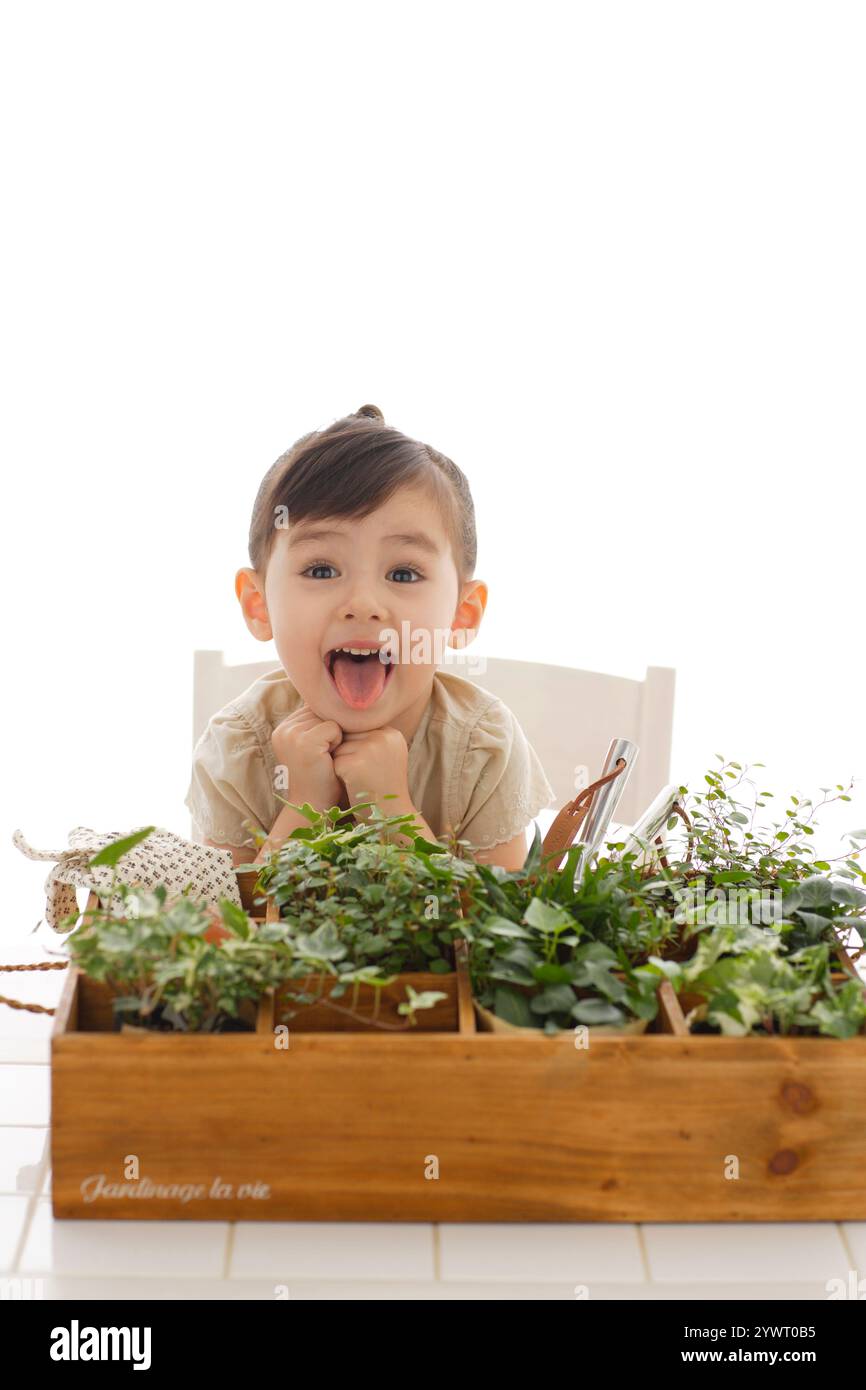 Girl interacting with plants Stock Photo - Alamy