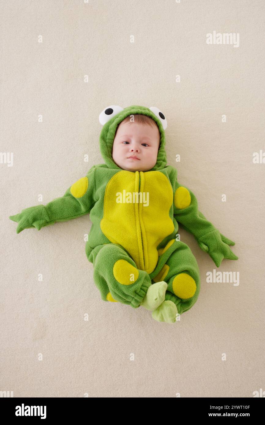 Baby in frog costume Stock Photo - Alamy