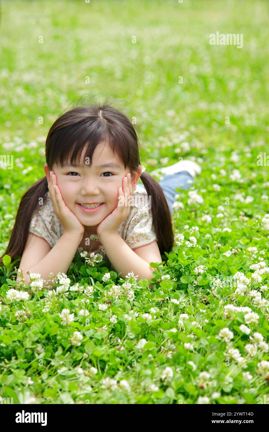 Happy school girl lying hi-res stock photography and images - Alamy