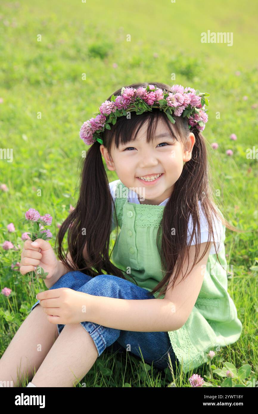 Girl wearing red clover flower crown Stock Photo - Alamy