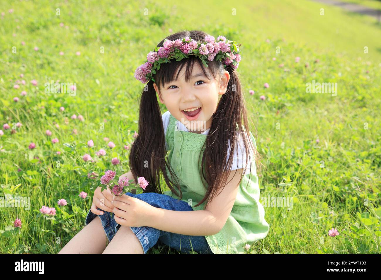 Girl wearing red clover flower crown Stock Photo - Alamy