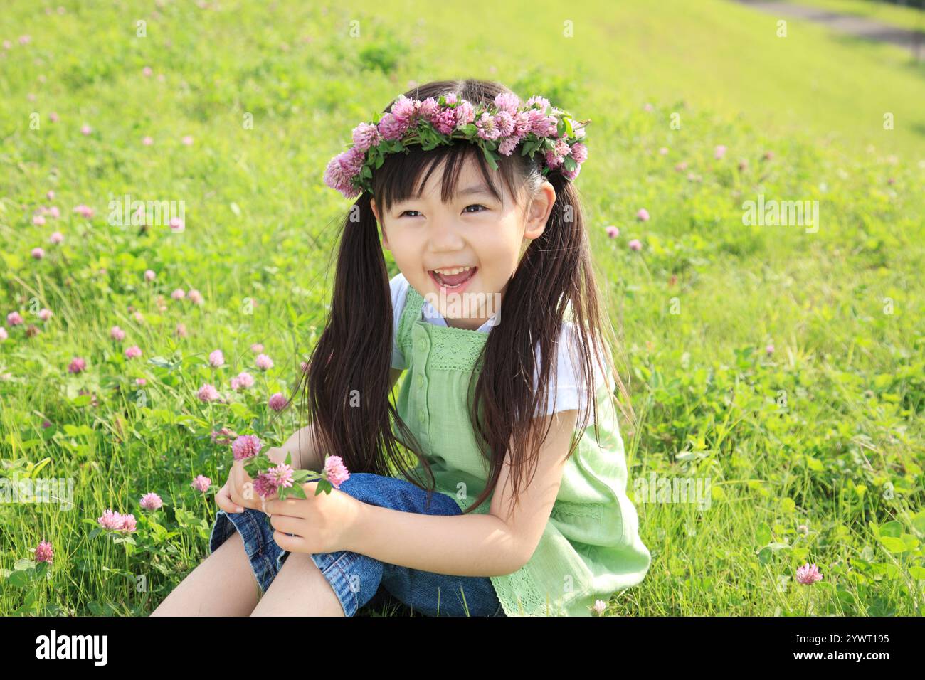 Girl wearing red clover flower crown Stock Photo - Alamy