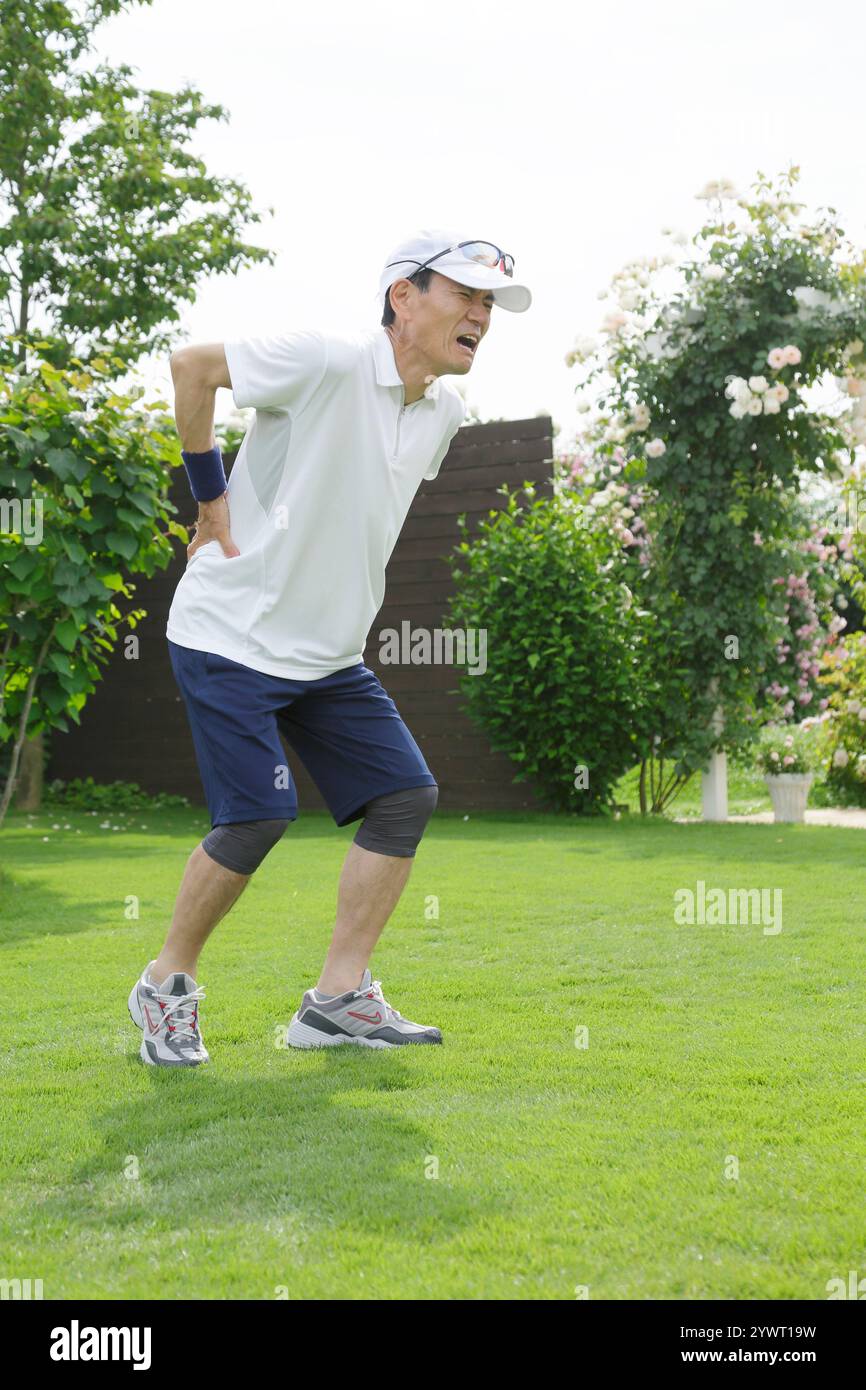 Senior men with back injuries during exercise Stock Photo - Alamy