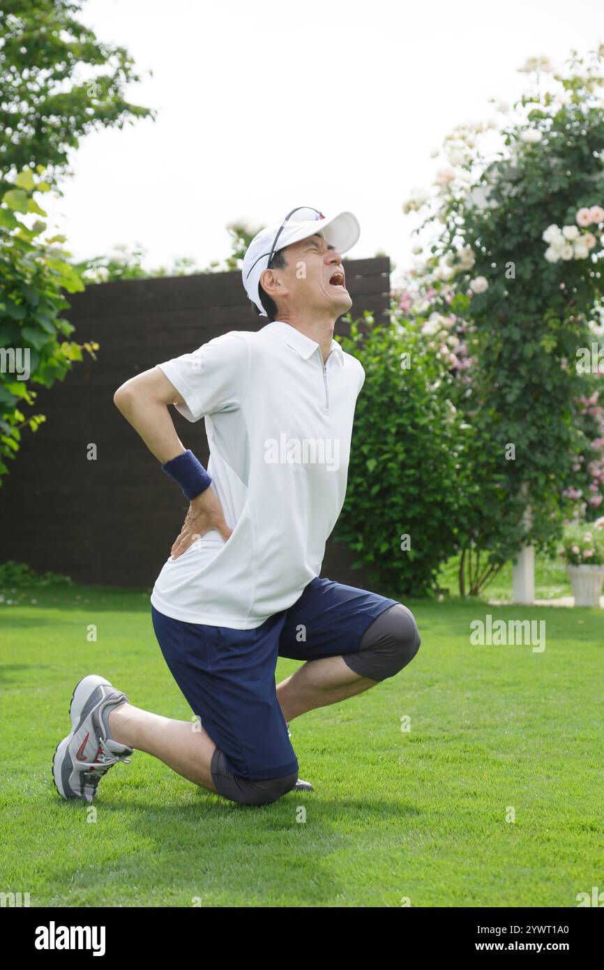 Senior men with back injuries during exercise Stock Photo - Alamy