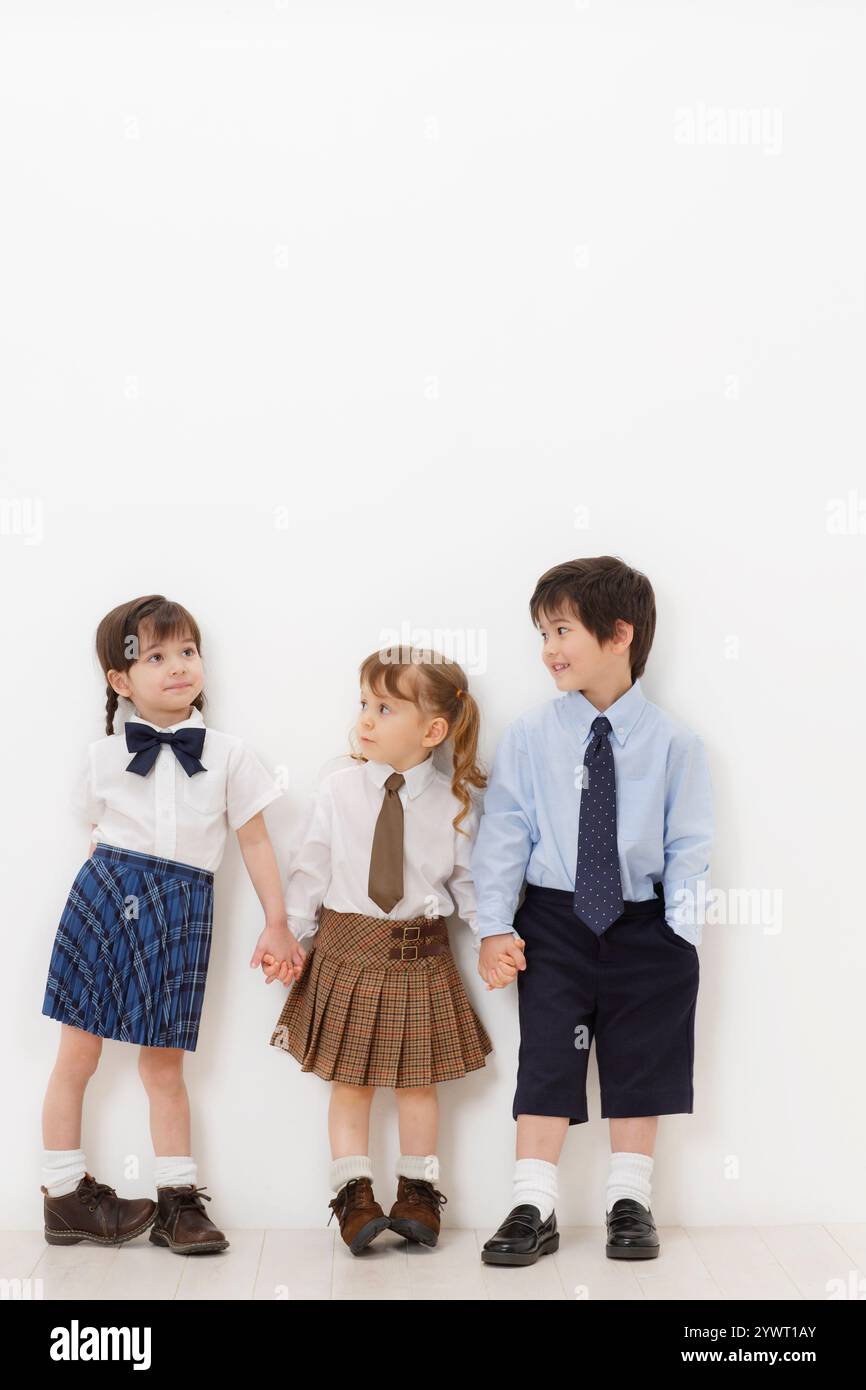 Half boys and girls in school uniform Stock Photo - Alamy