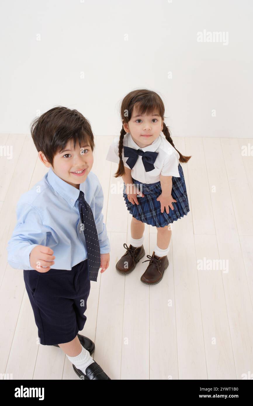 Half boys and girls in school uniform Stock Photo - Alamy