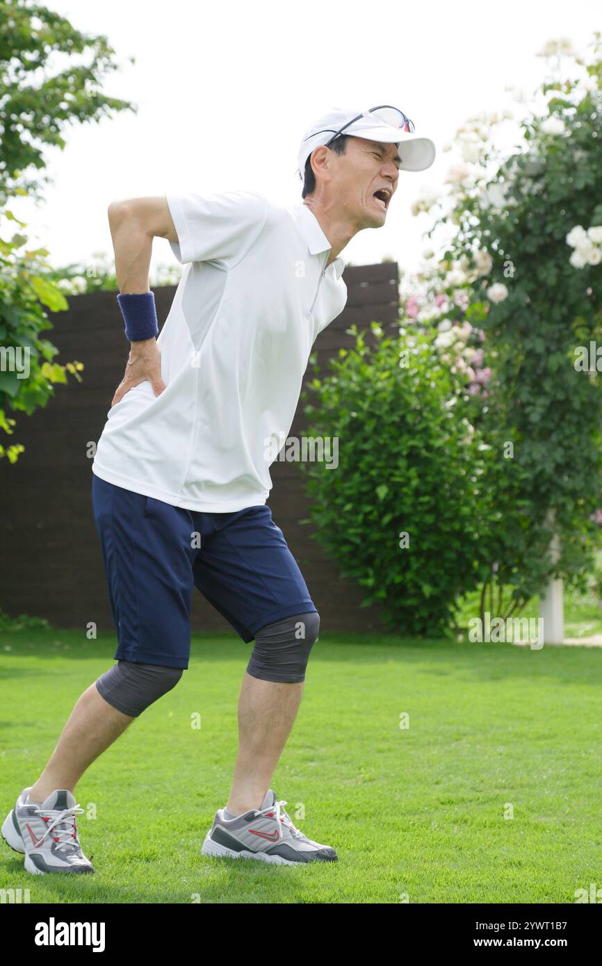 Senior men with back injuries during exercise Stock Photo - Alamy