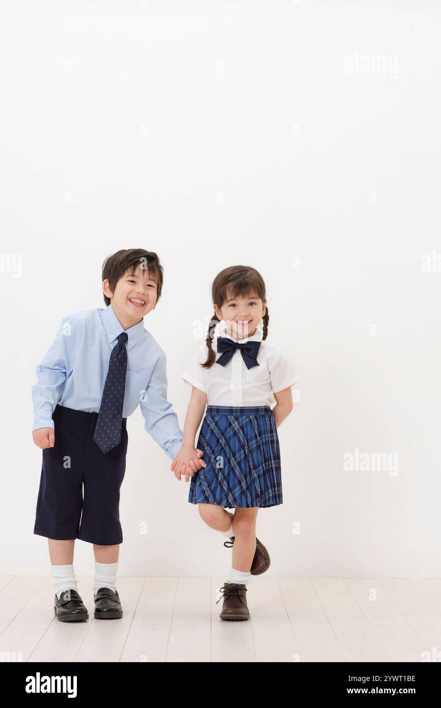 Half boys and girls in school uniform Stock Photo - Alamy