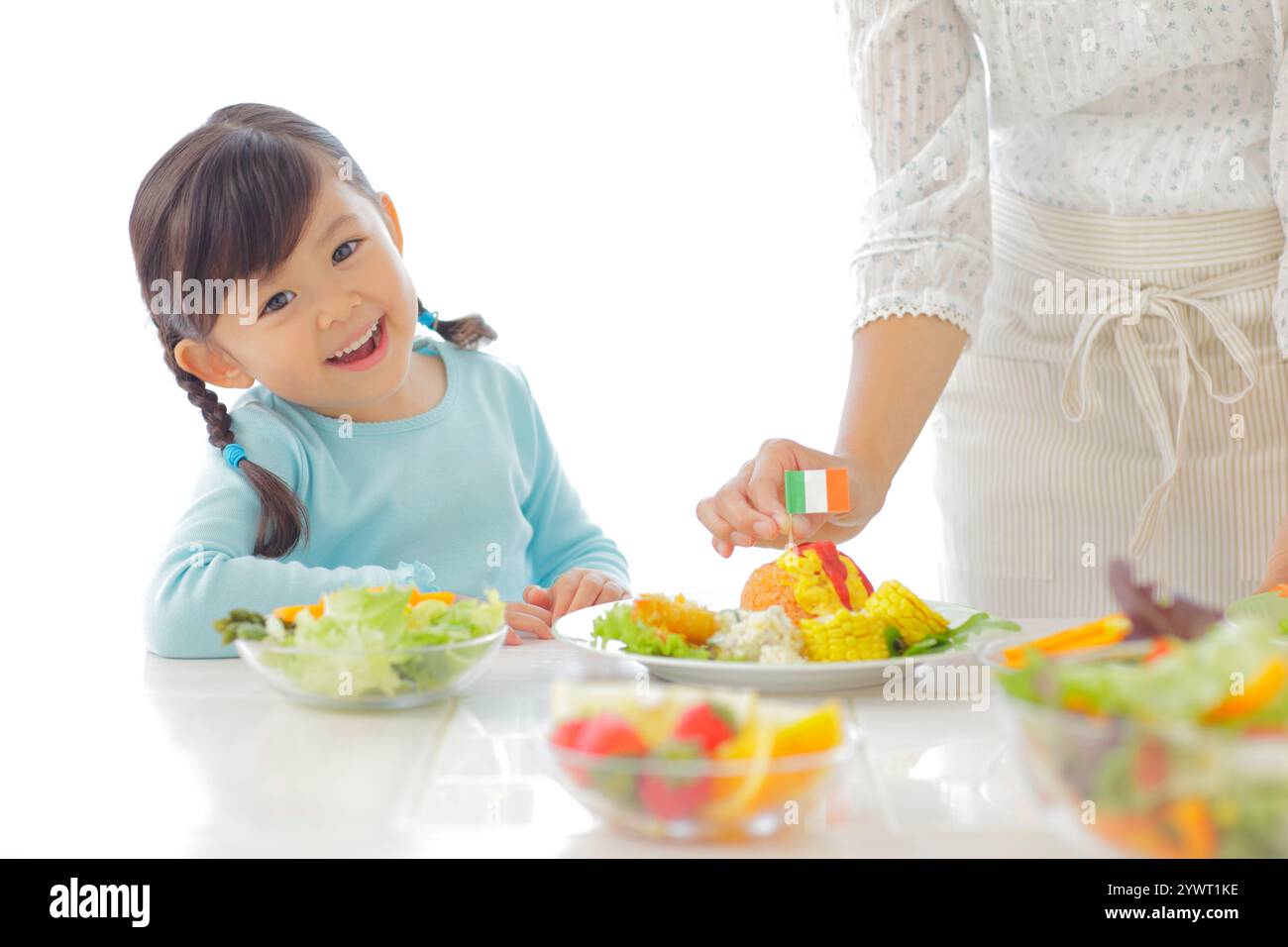 Mother and girl cooking food Stock Photo - Alamy