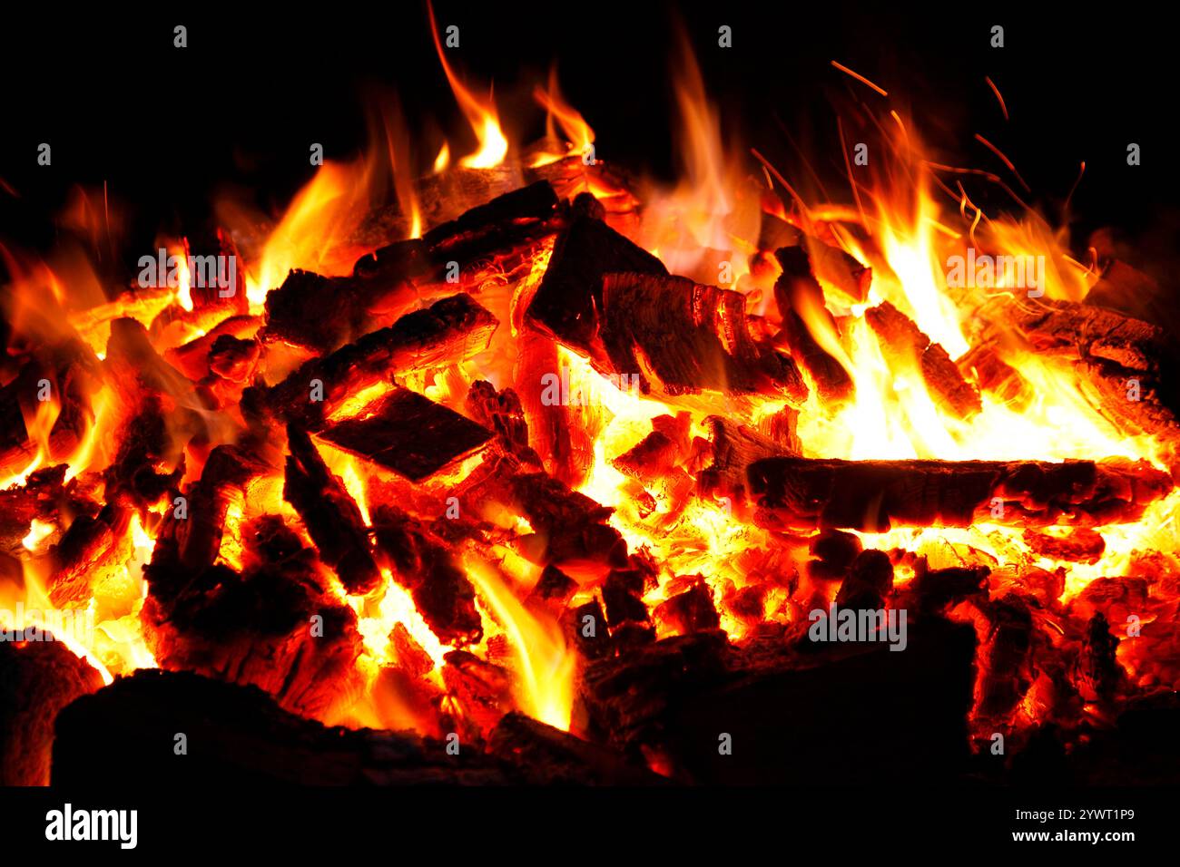 Burning wood with bright red flames Stock Photo - Alamy