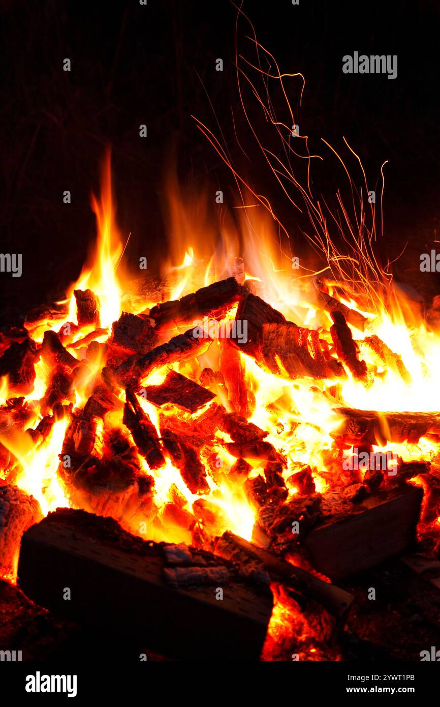 Burning wood with bright red flames Stock Photo - Alamy