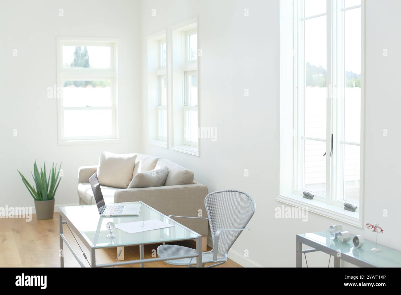 Bright living room with computer and desk Stock Photo - Alamy