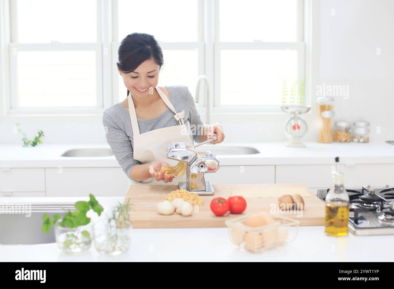 Woman making pasta dough Stock Photo - Alamy