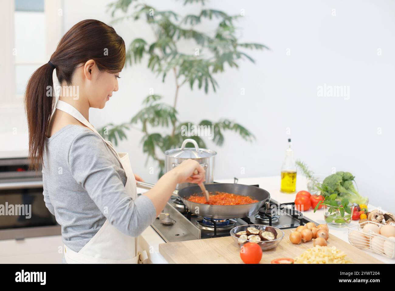 Woman tomato sauce making hi-res stock photography and images - Alamy