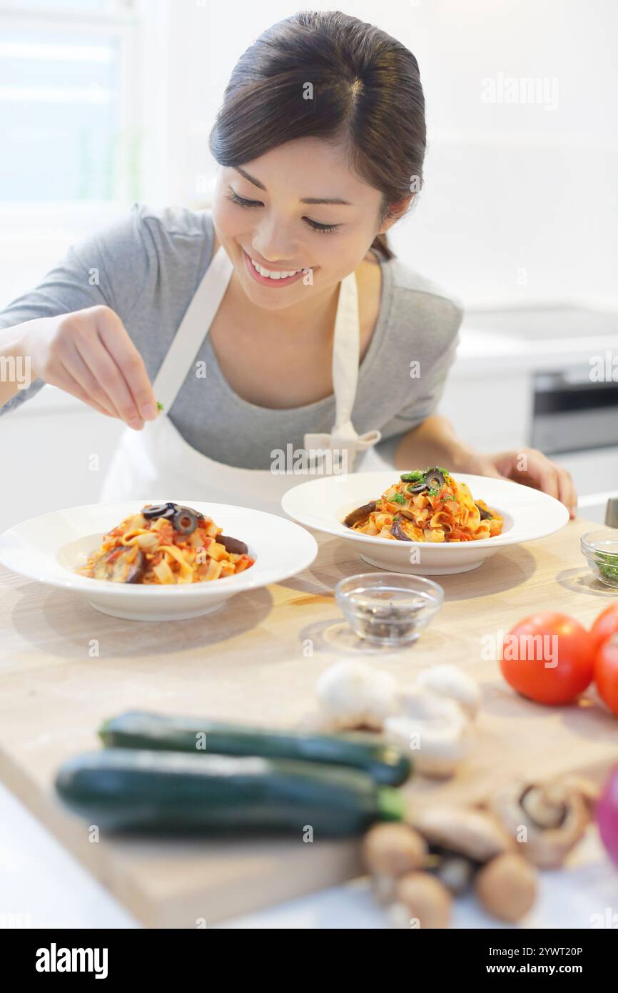 Woman making pasta Stock Photo - Alamy