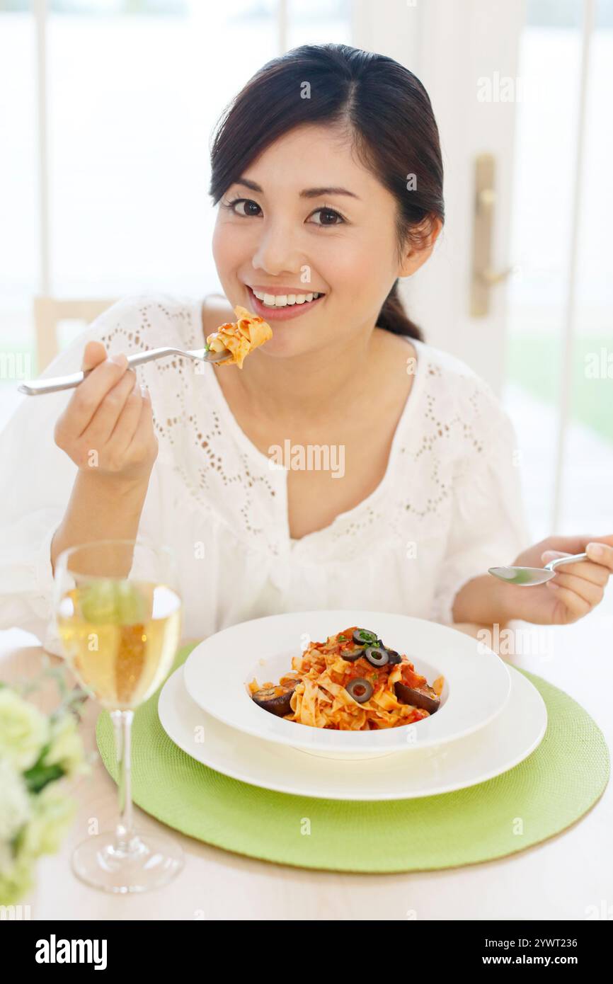 Black woman eating pasta hi-res stock photography and images - Alamy