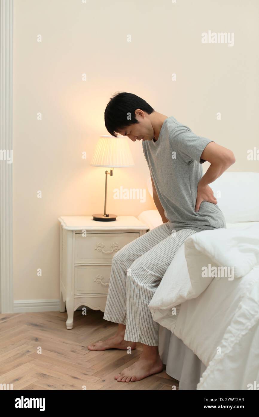 Man suffering from back pain Stock Photo - Alamy