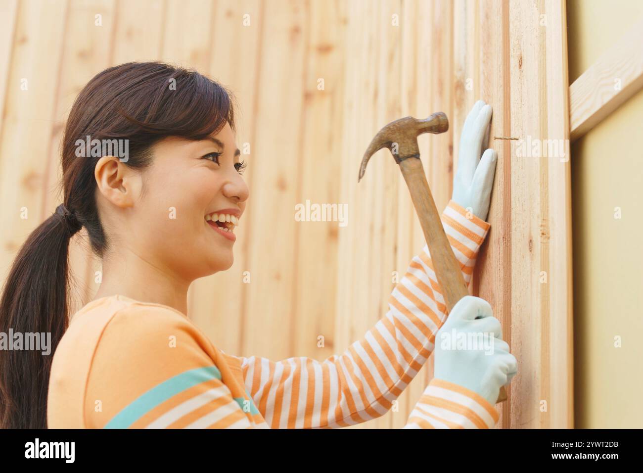 Woman doing Sunday carpentry Stock Photo - Alamy